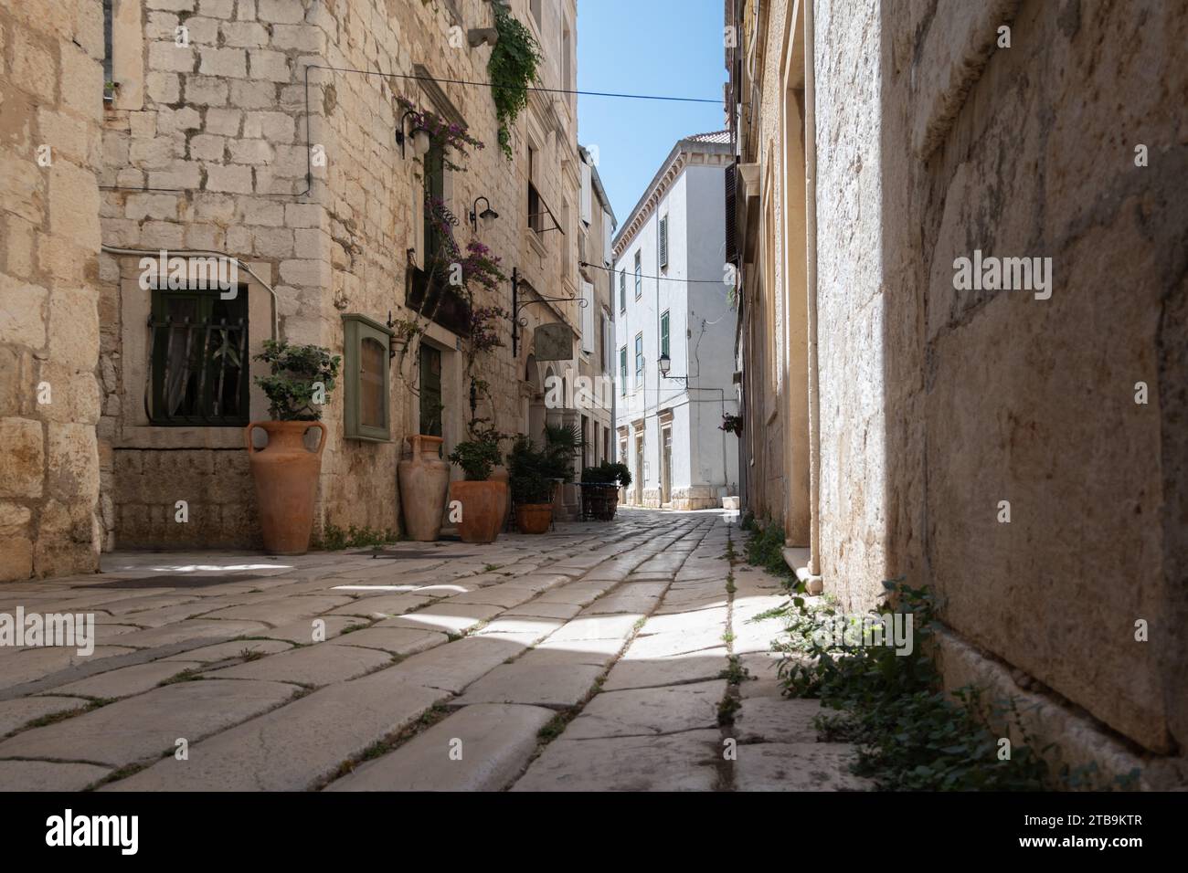 Street view of empty streets and alleyways lined with tradional stone ...