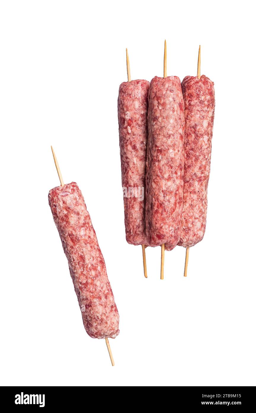 Raw kofta or lula kebabs skewers on butcher board. Isolated, white ...