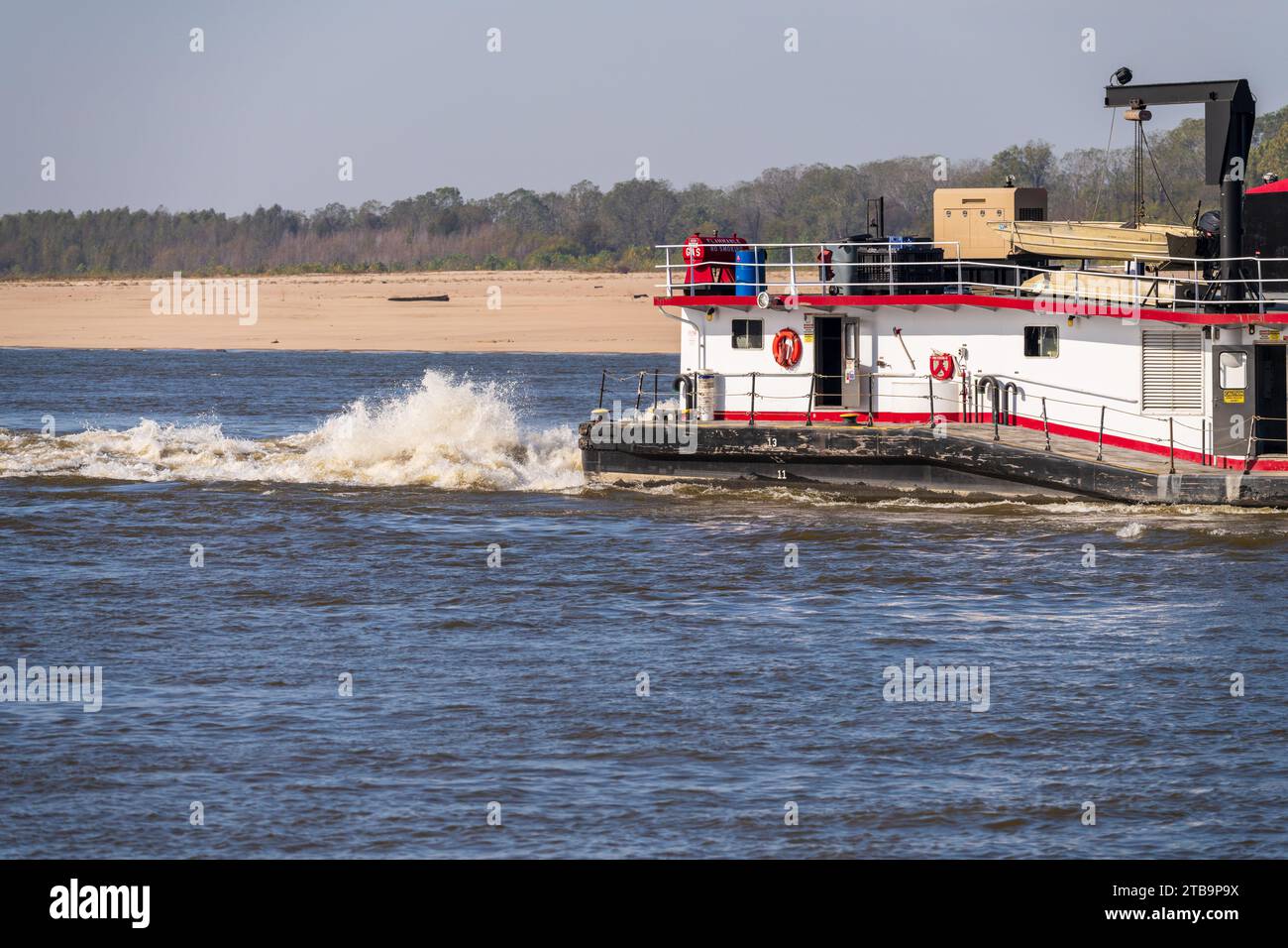 Detail of the stern of a pusher boat or tugboat churning the ...