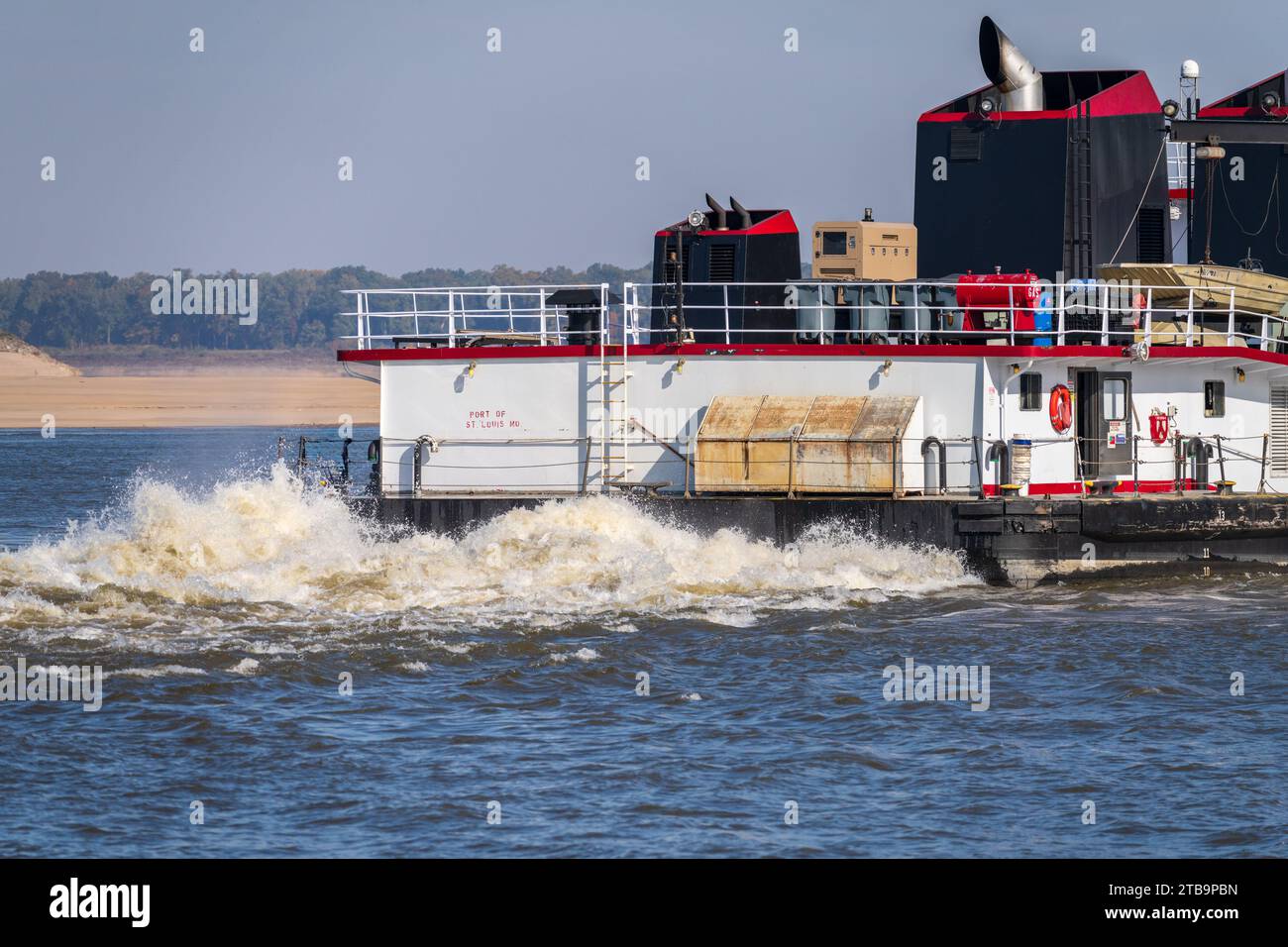 Detail of the stern of a pusher boat or tugboat churning the ...