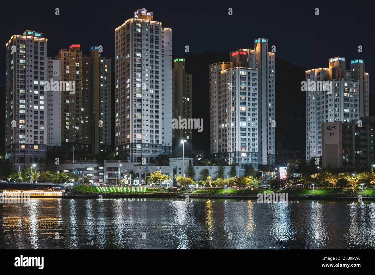 An aerial view of downtown cityscape, featuring illuminated high-rise ...