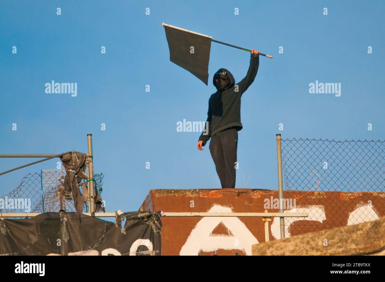 The black flag, symbol of non-surrender, is waved by one of the ...