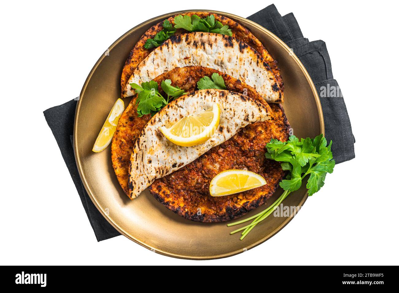 Turkish lahmacun pizza with mince meat and tomatoes on a plate with ...