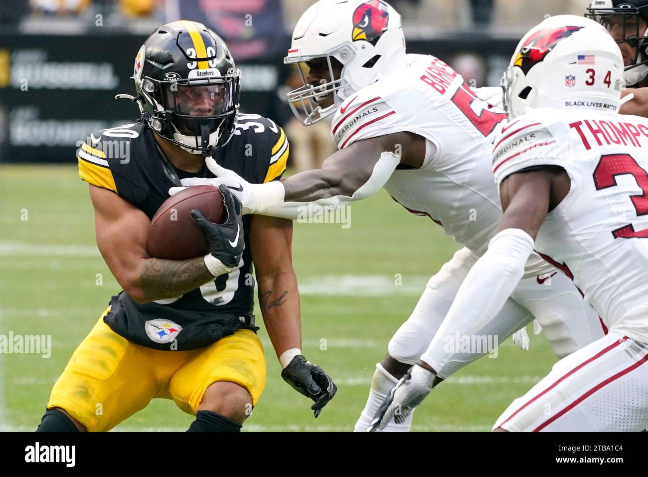 Pittsburgh Steelers running back Jaylen Warren (30) is tackled by ...