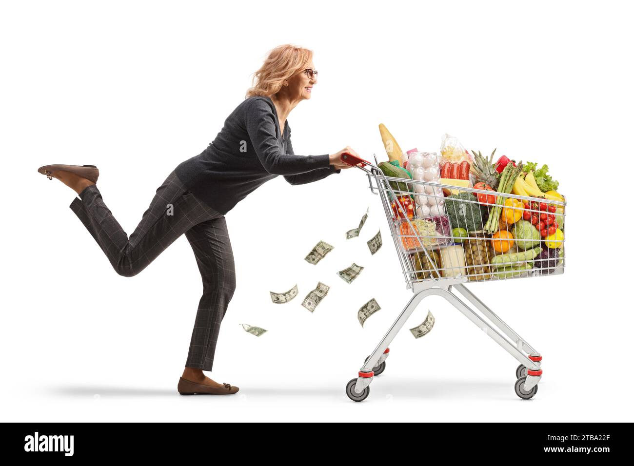 Full length profile shot of a woman running with a shopping cart ...