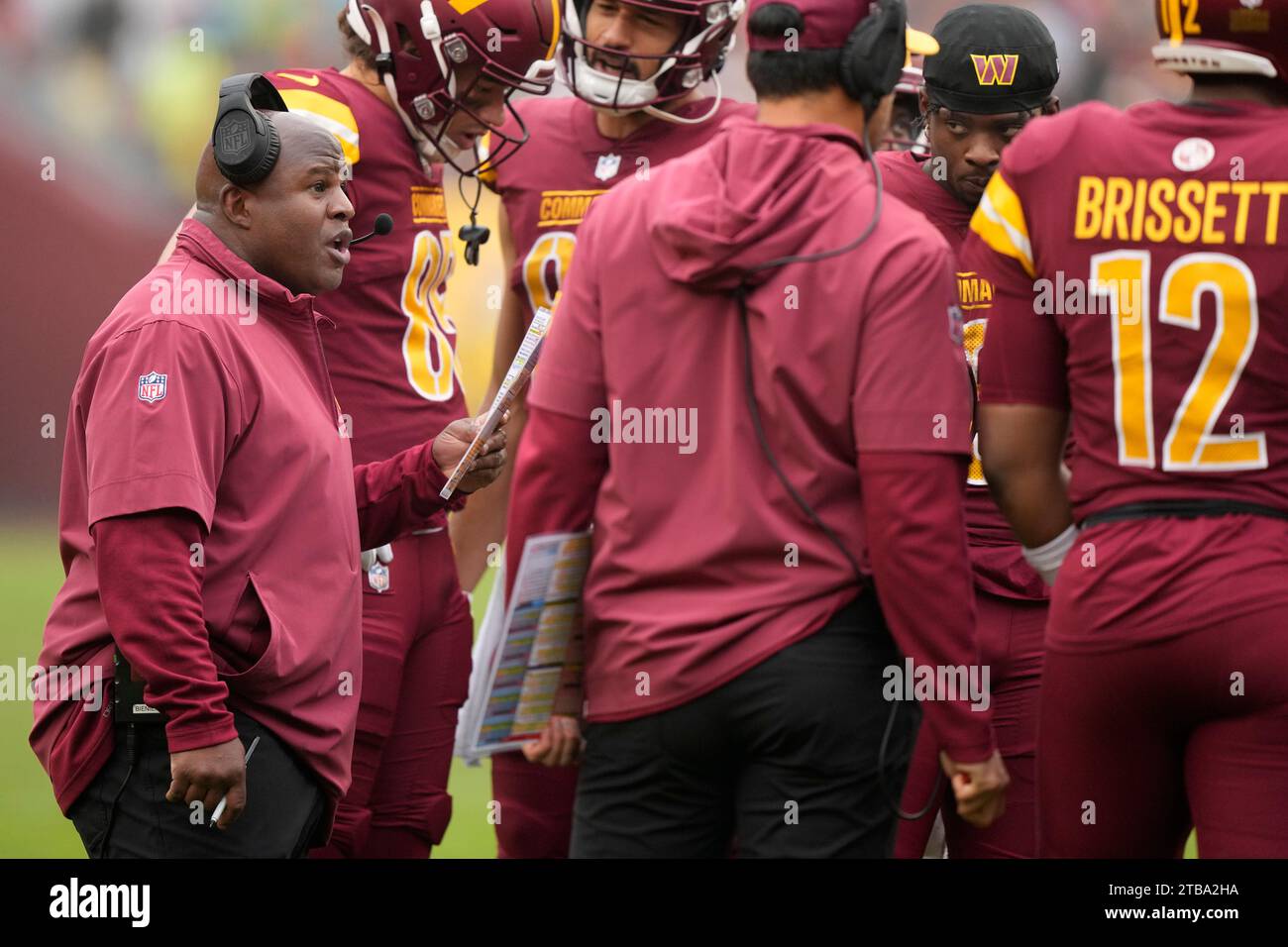 Washington Commanders offensive coordinator Eric Bieniemy talks with ...