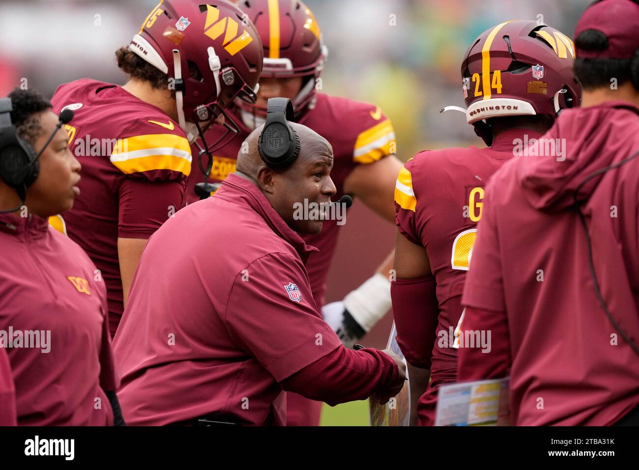 Washington Commanders offensive coordinator Eric Bieniemy talks with ...