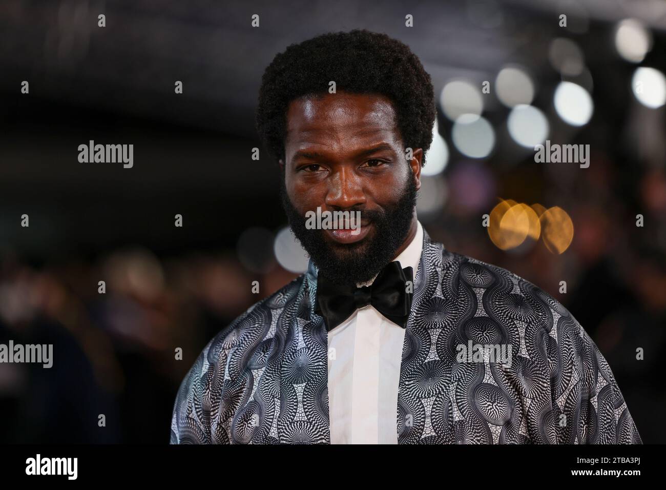 Sope Dirisu poses for photographers upon arrival at the premiere for ...