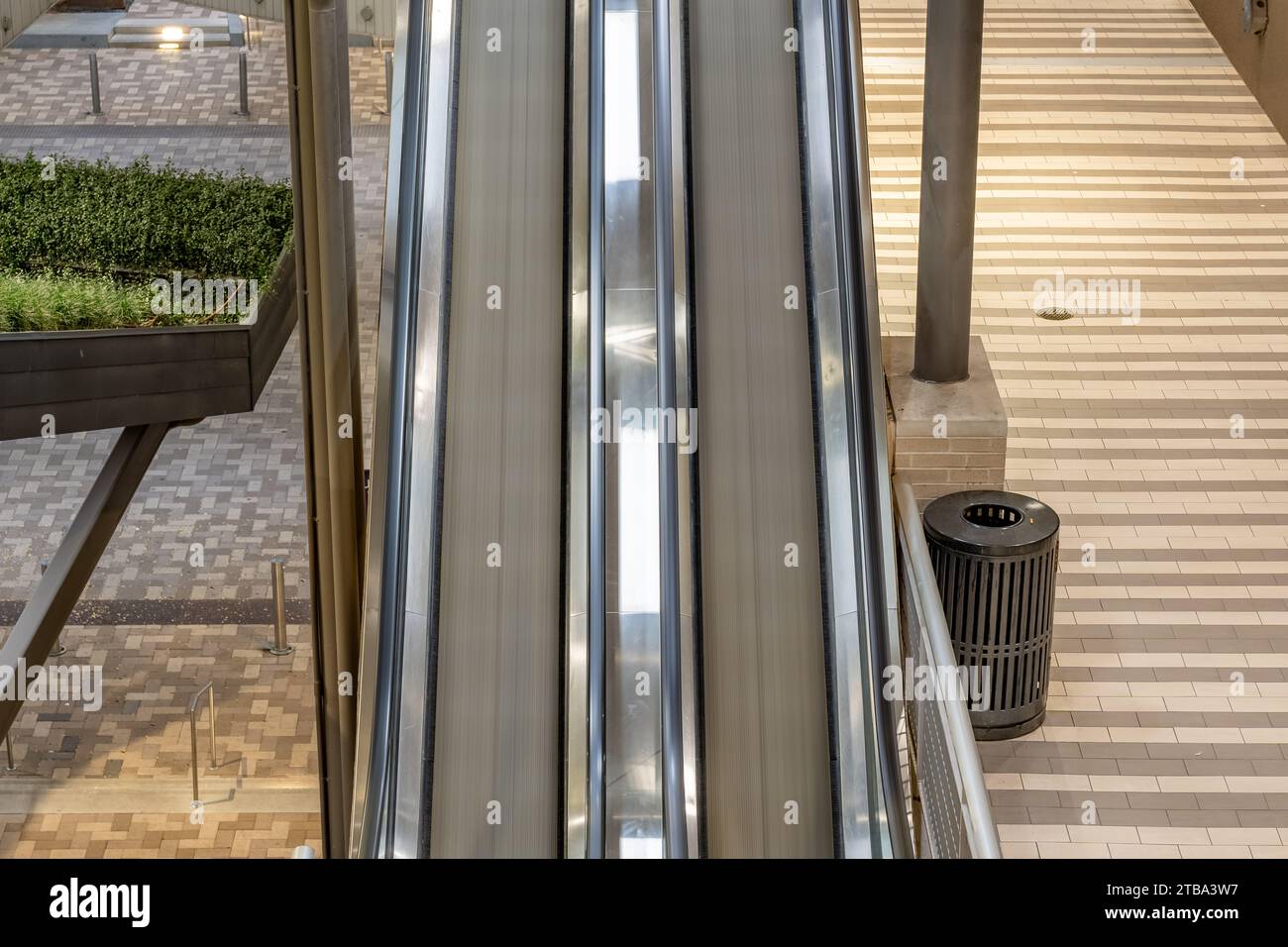 Outdoor escalator, moving staircase, in a downtown setting. Long ...