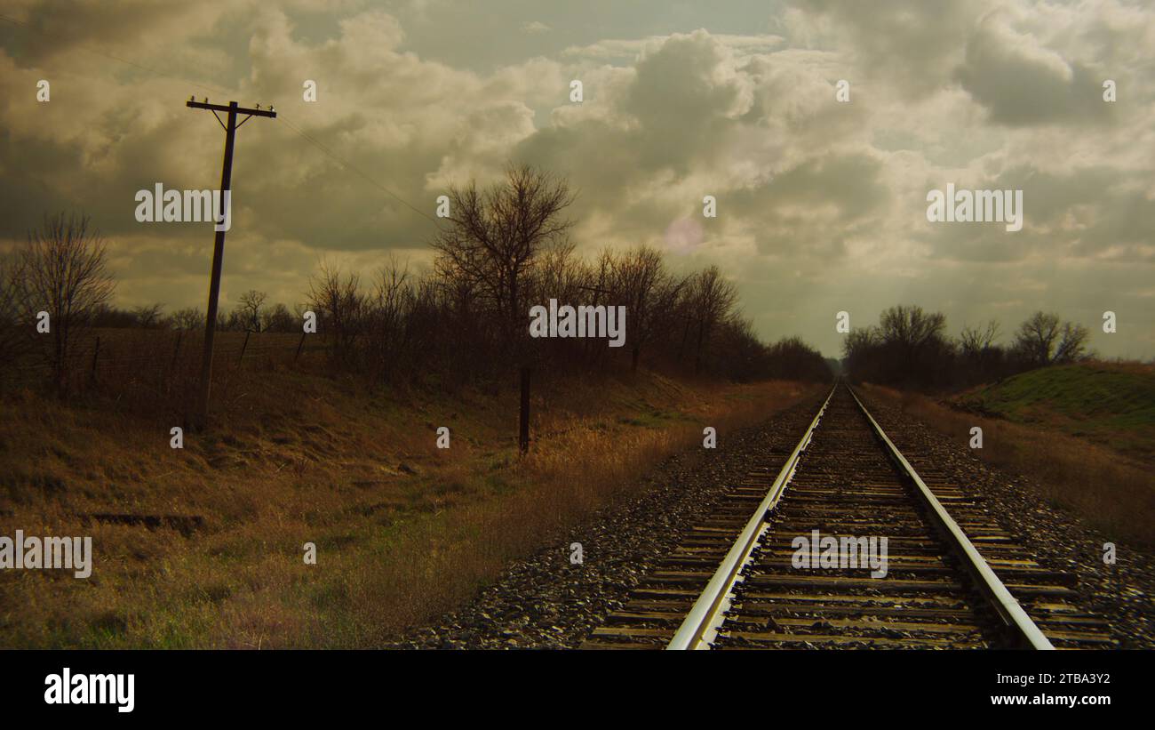 Billowing clouds float above railroad tracks on a late winter day Stock ...