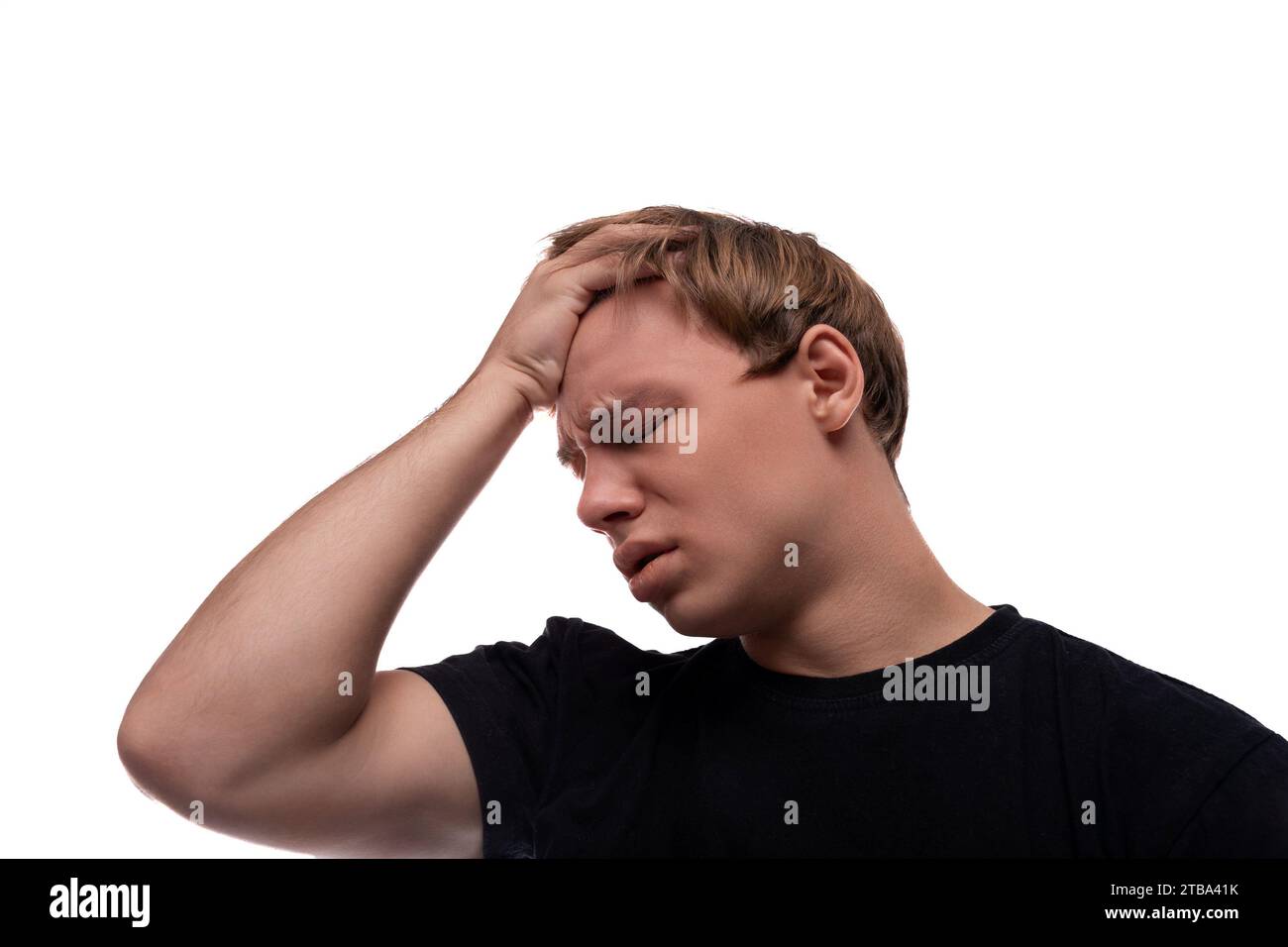 Puzzled teenager boy holding his head Stock Photo - Alamy