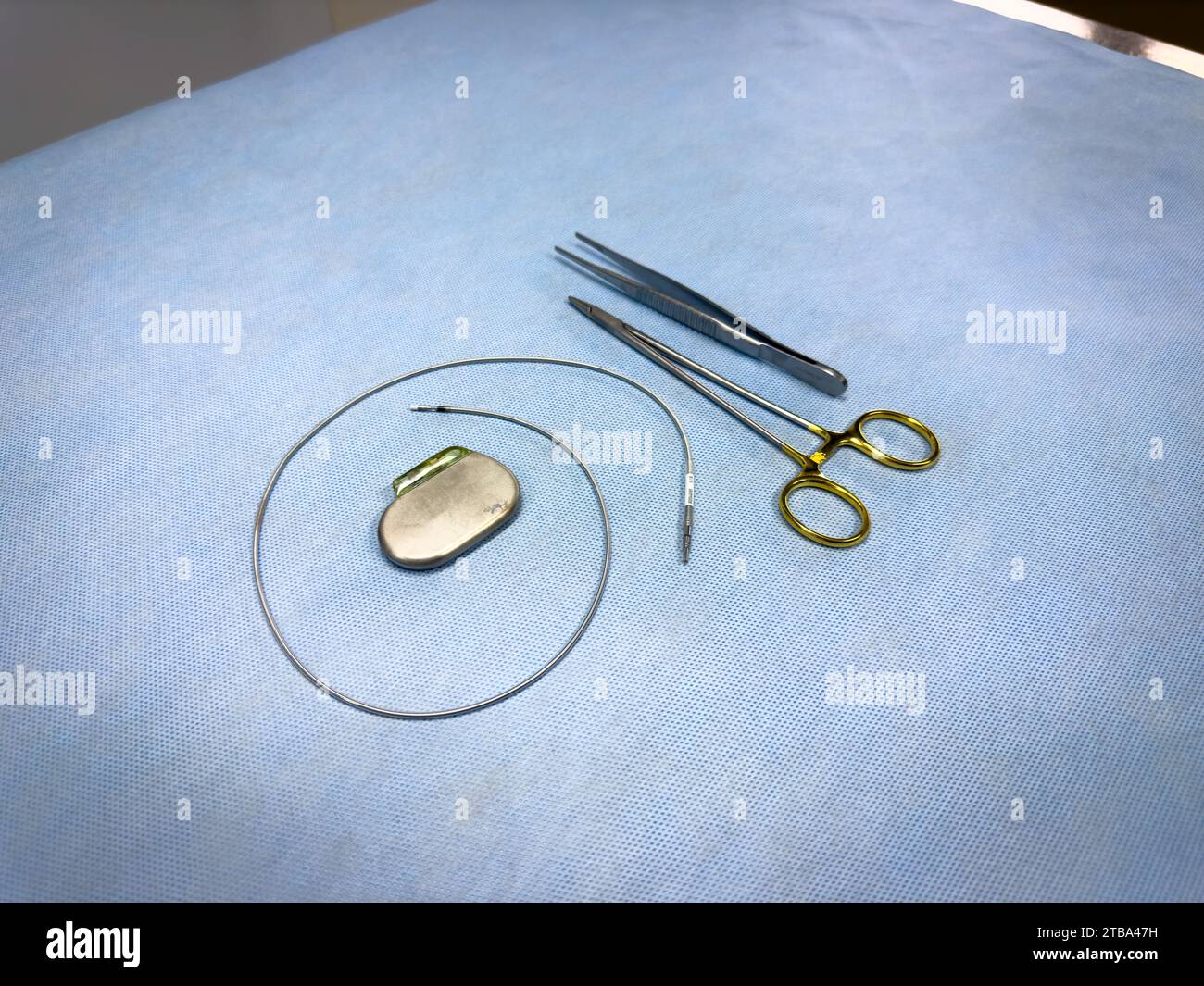 Next to a pacemaker are surgical instruments Stock Photo - Alamy