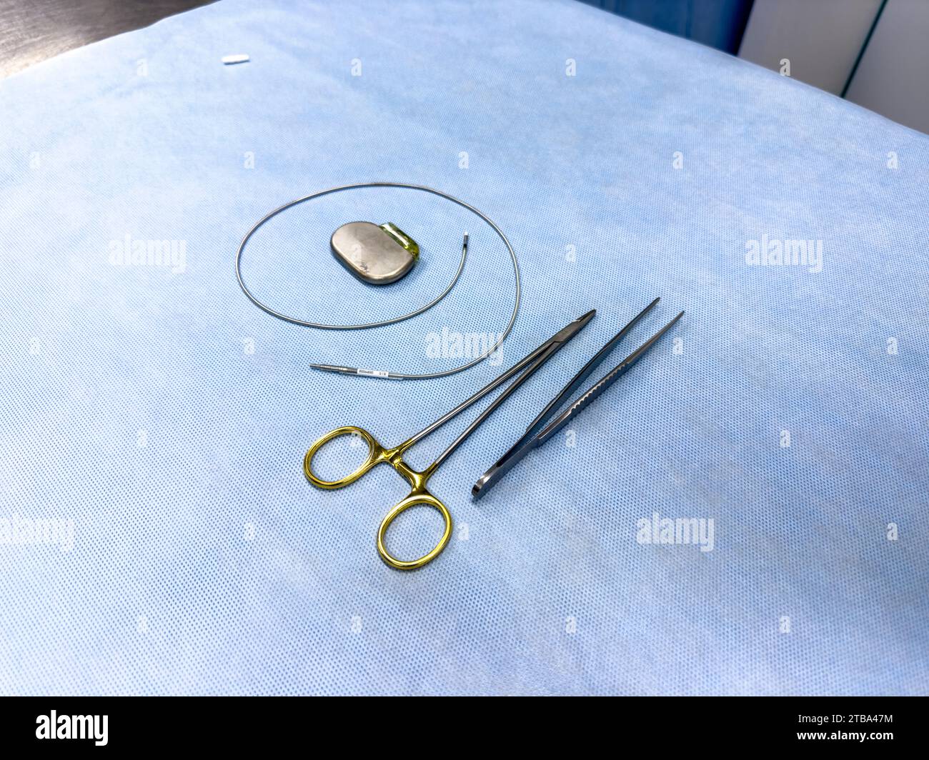 Next to a pacemaker are surgical instruments Stock Photo - Alamy