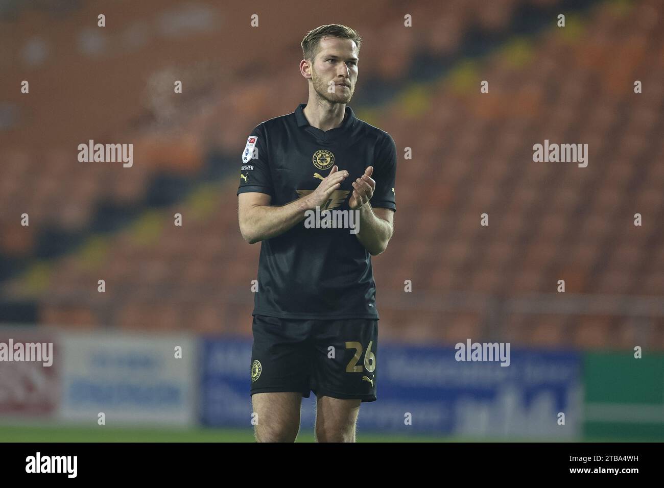 Jamie McCart #26 of Barnsley applauds the travelling fans during the ...
