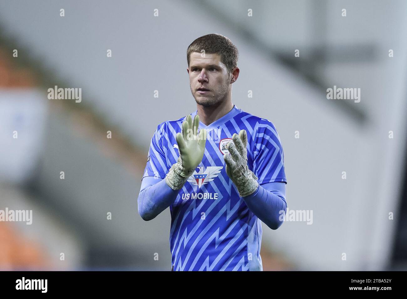Ben Killip #23 of Barnsley applauds the travelling fans during the ...