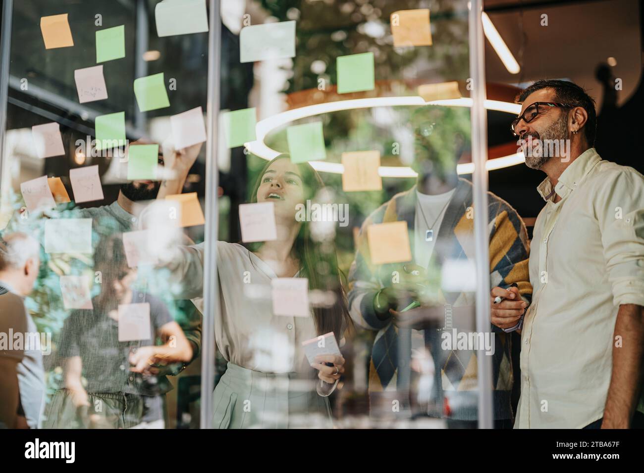 Creative business group brainstorming ideas and strategies in a diverse ...