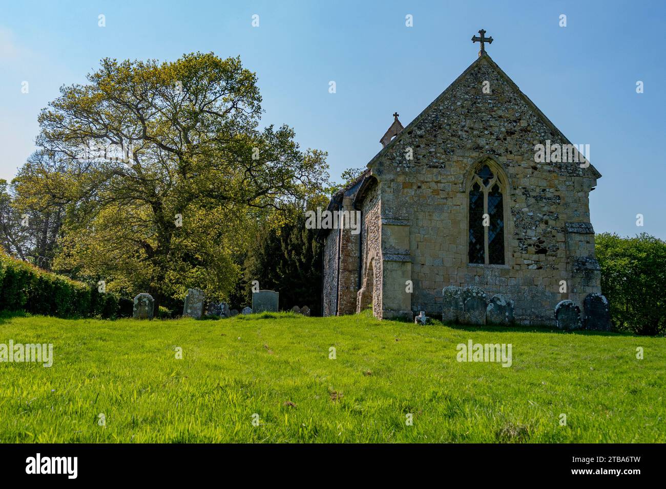 Glimpsed through a footpath gate is the 11th Century All Saints Chapel ...