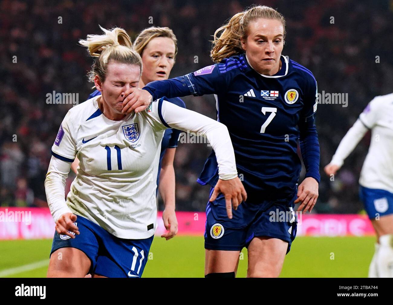 Scotland's Fiona Brown (right) holds back England's Lauren Hemp during ...