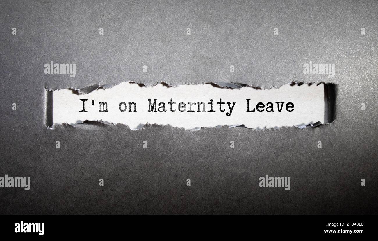 Recycled paper note pinned on cork board.I'm on Maternity Leave Message ...