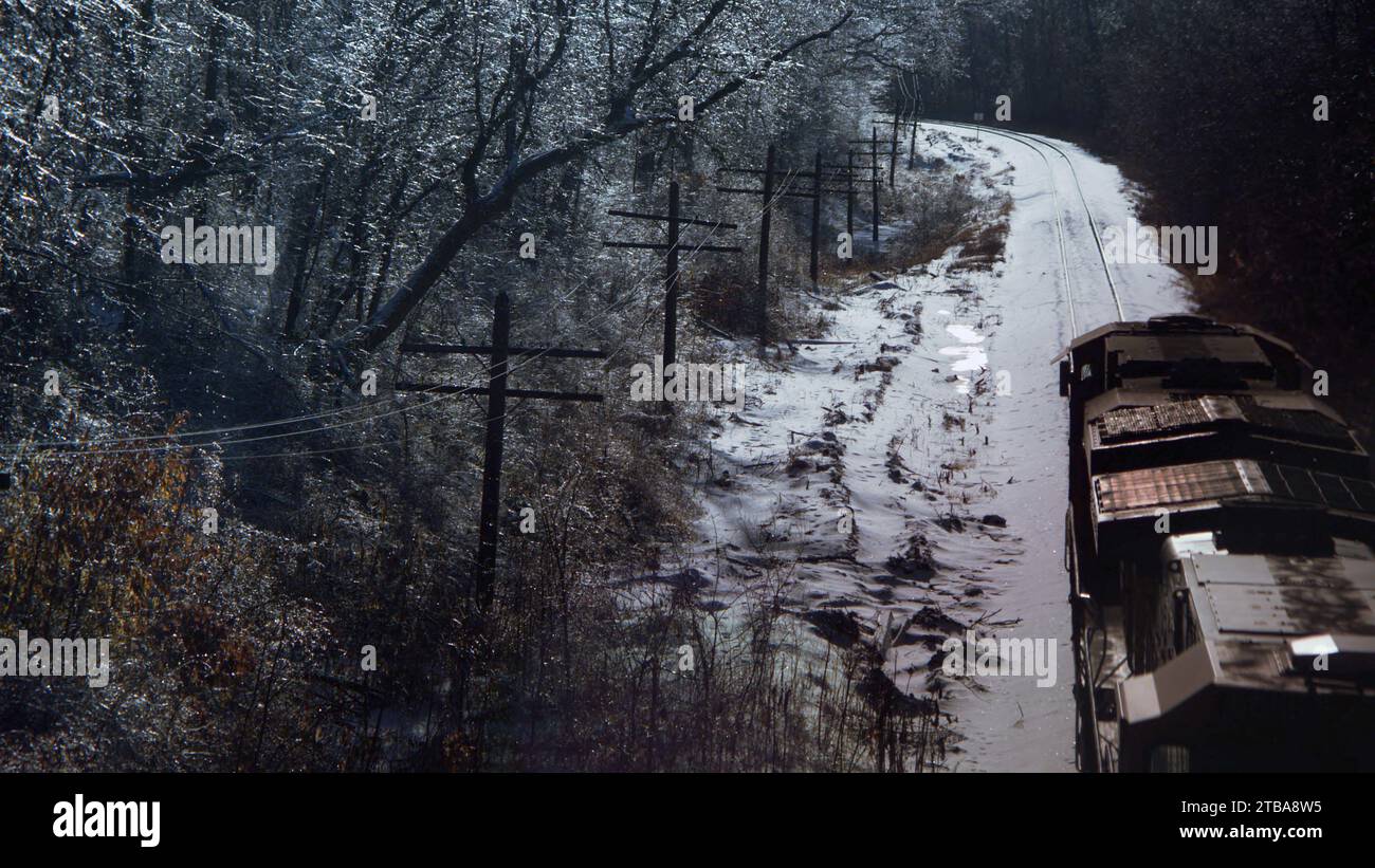 Freight train passing through rural woodlands after an ice storm Stock ...