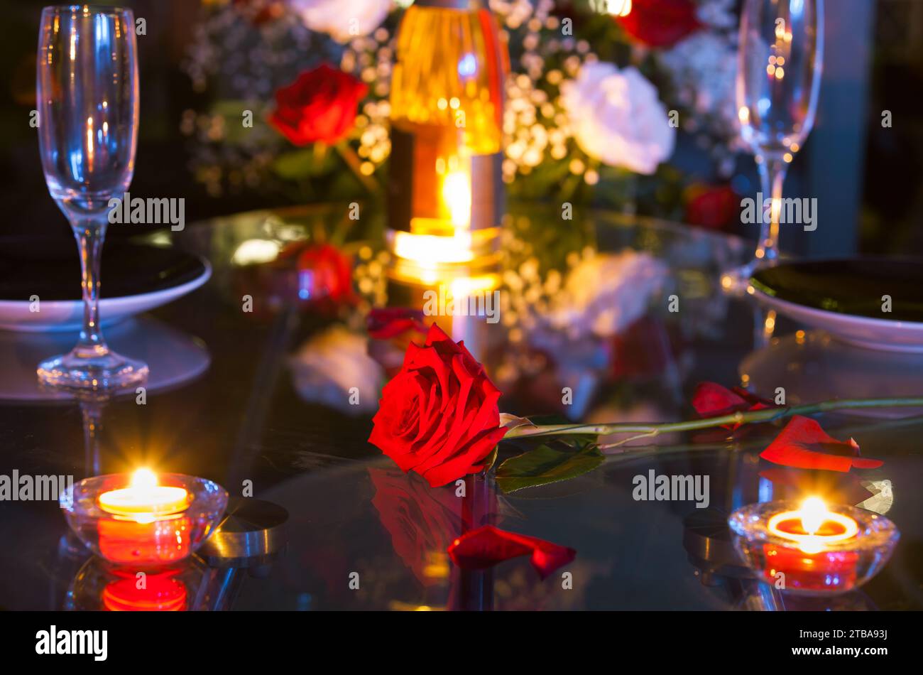 Romantic candlelight dinner restaurant setting with roses and champagne ...