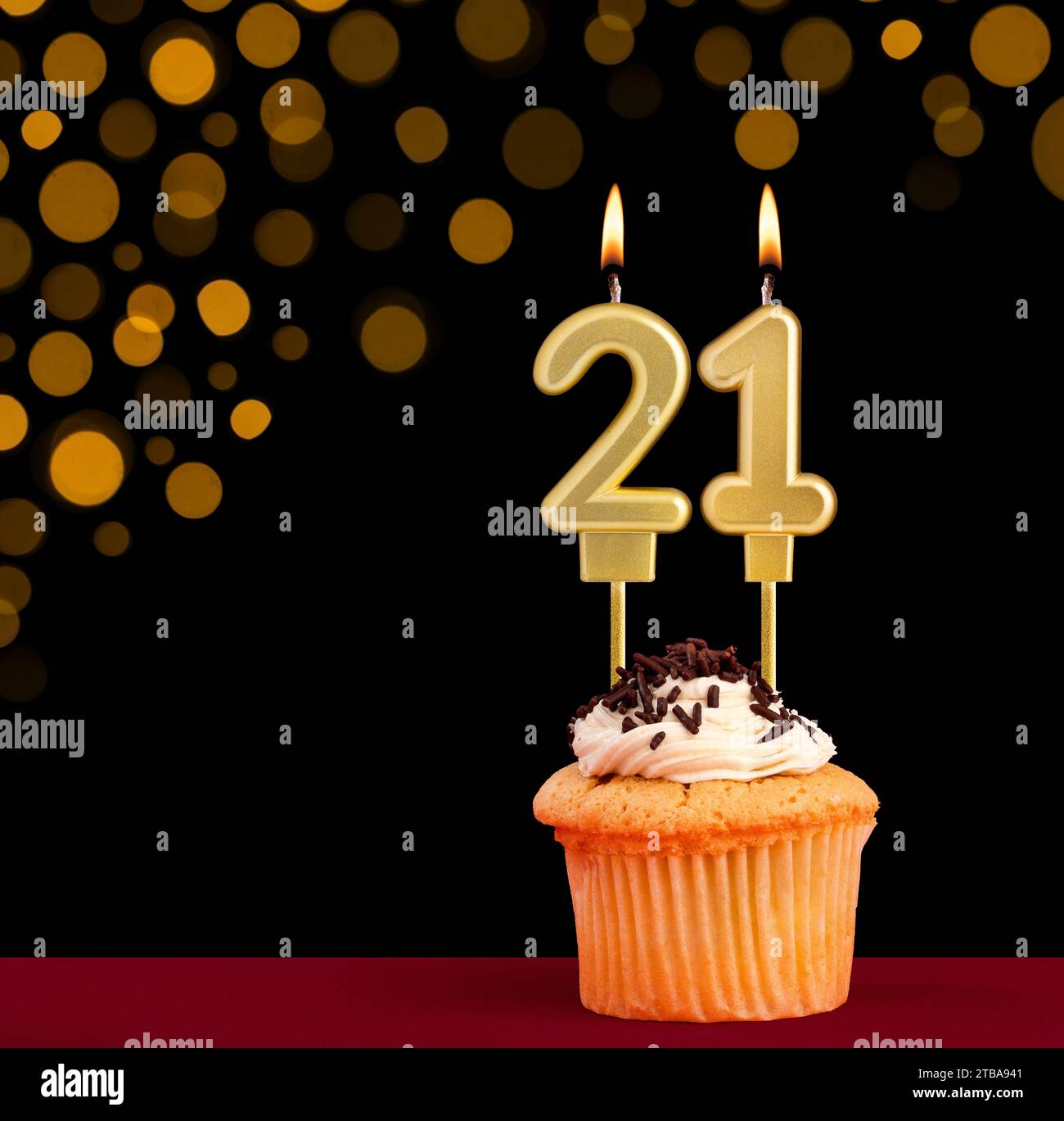 Number 21 birthday candle - Cupcake on black background with out of ...