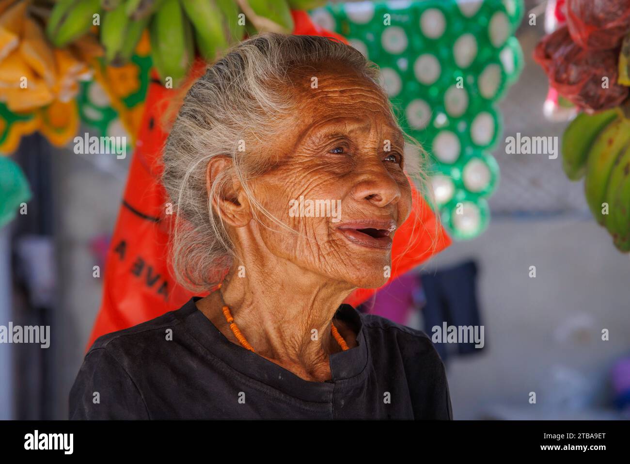 An old woman with a weathered face in a market, Baucau, The Democratic ...
