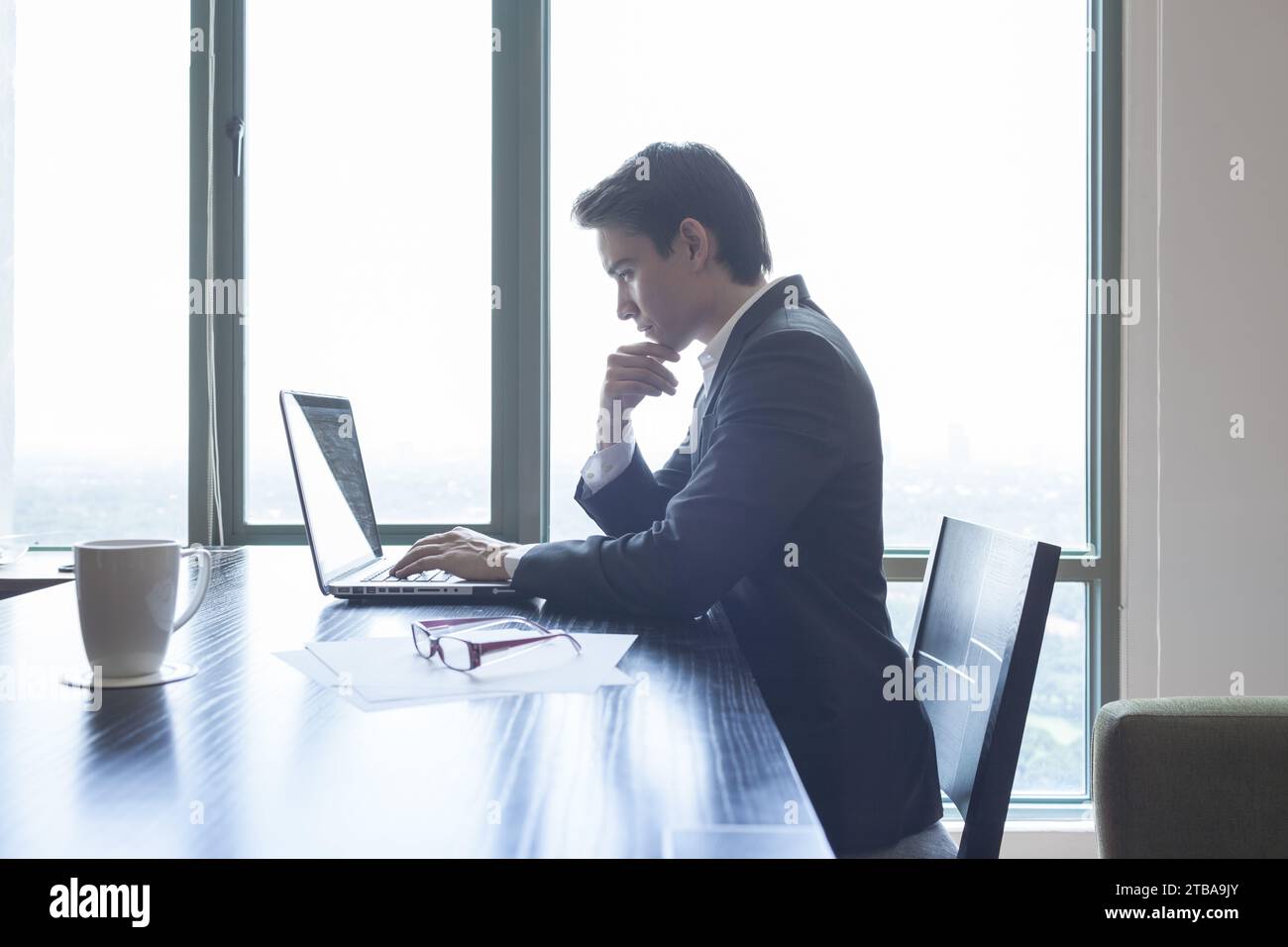 Businessman sitting office desk hi-res stock photography and images - Alamy