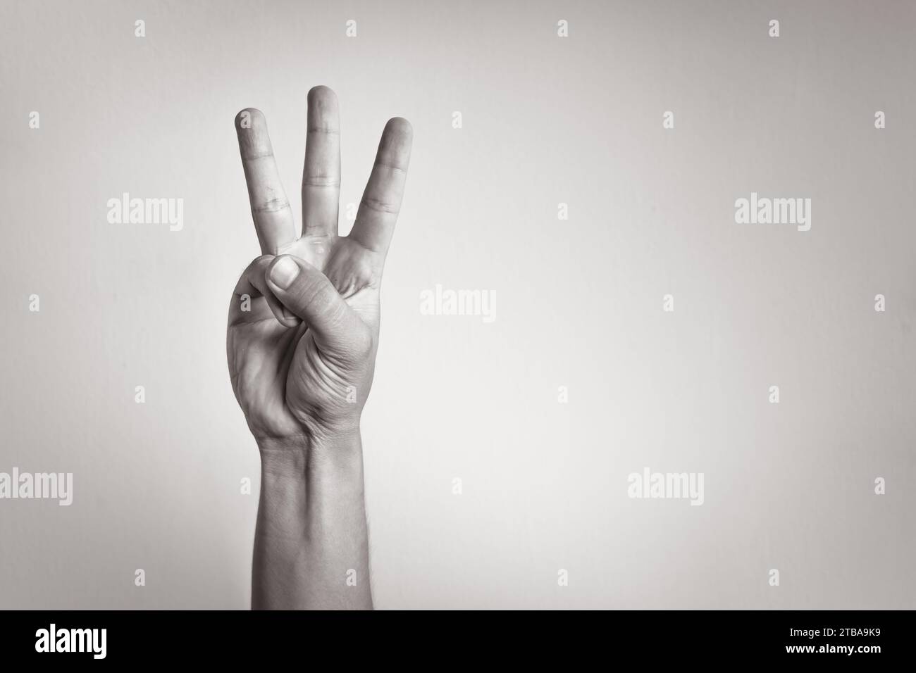 Three finger hand gesture sign hi-res stock photography and images - Alamy