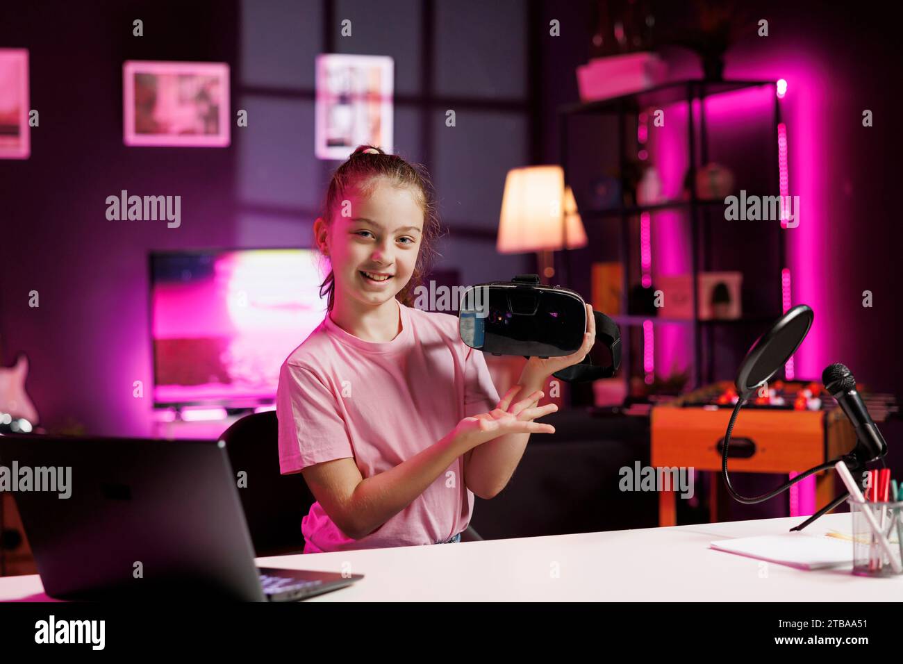 Smiling kid filming sponsored content, unboxing newly released VR ...