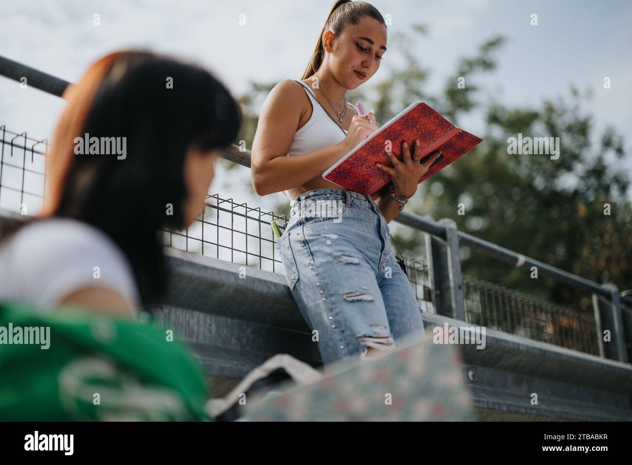 Urban Study Session: Female High School Students Collaborating on ...