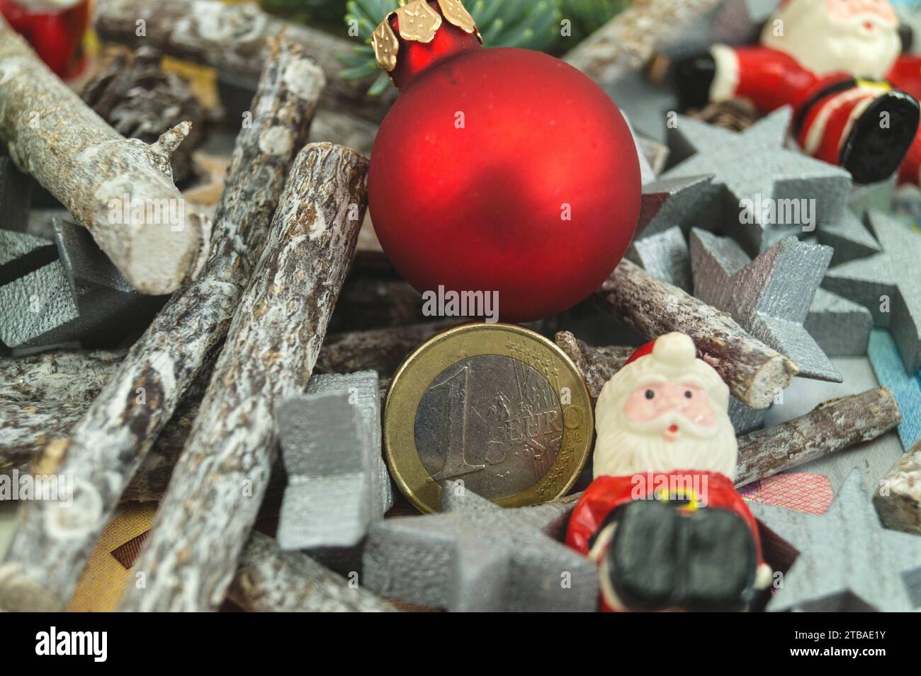 Santa Clauses, Christmas tree ball, stars, fir twigs and Euro, symbol ...