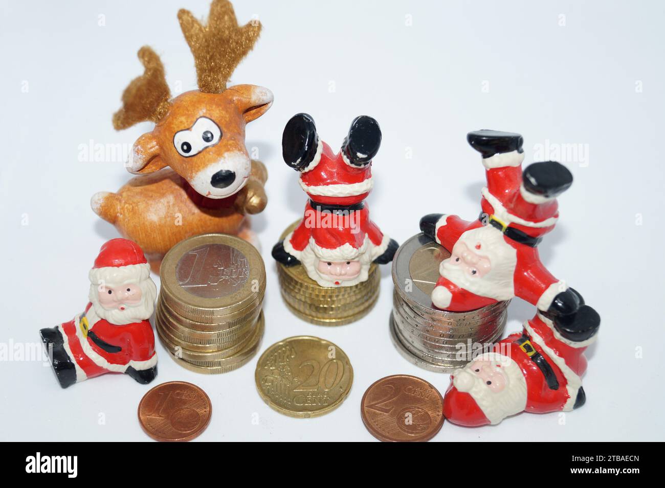 Santa Clauses, elk, and Euro coins, symbol picture for end-of-year ...