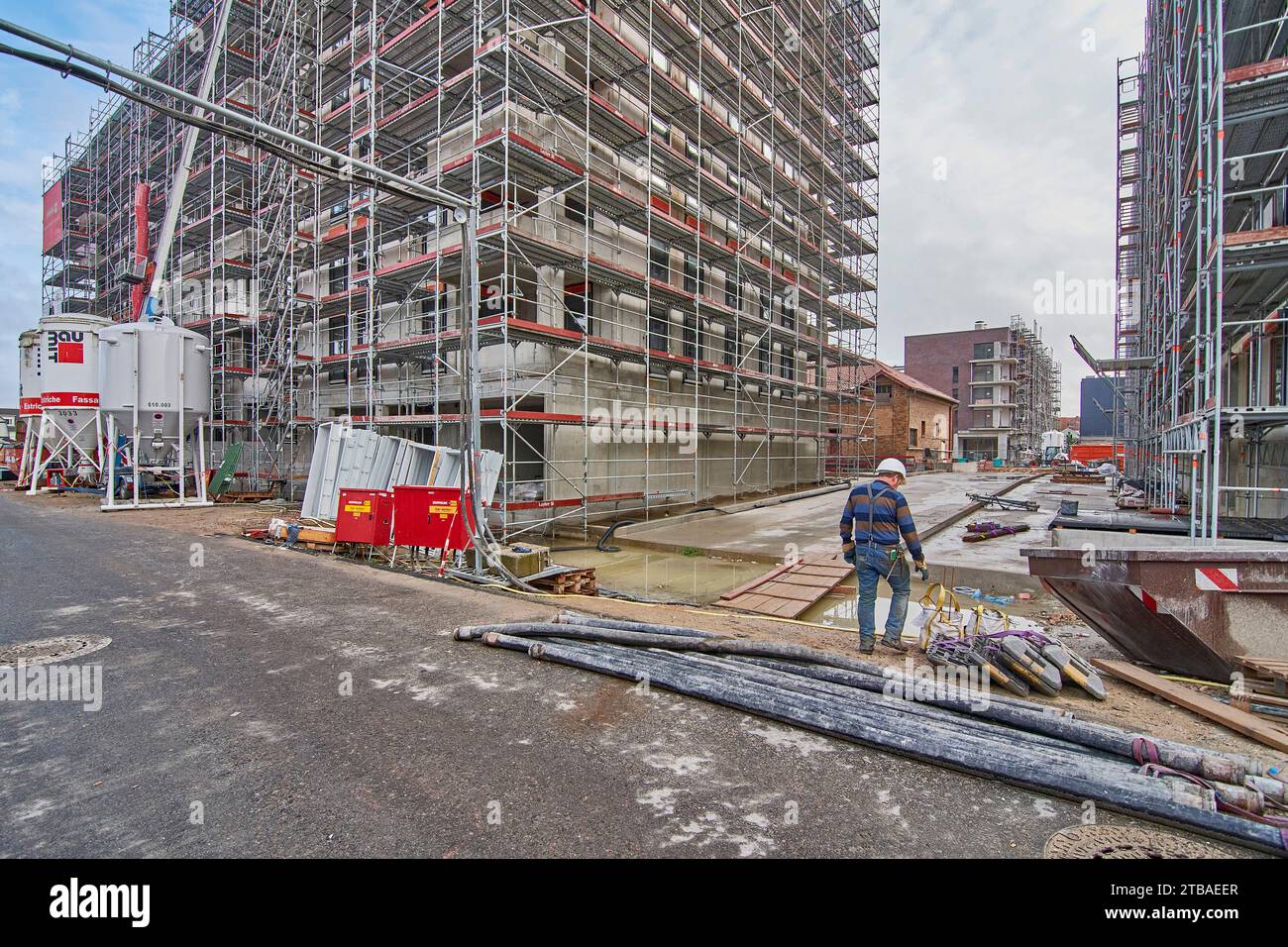 construction workers between new buildings in the shell, Germany Stock ...