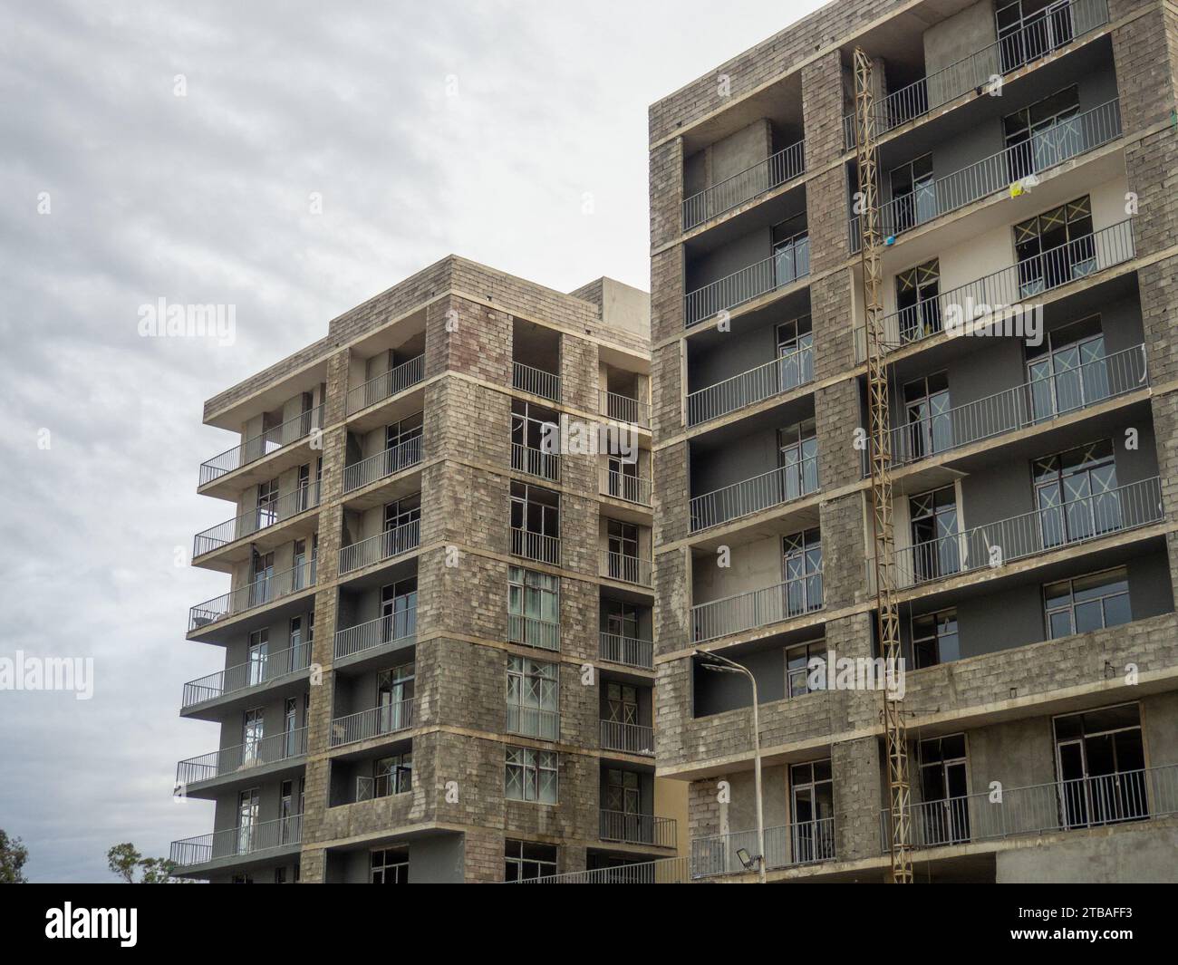 A gloomy gray building. Unfinished brutalist house. Concept of crisis ...