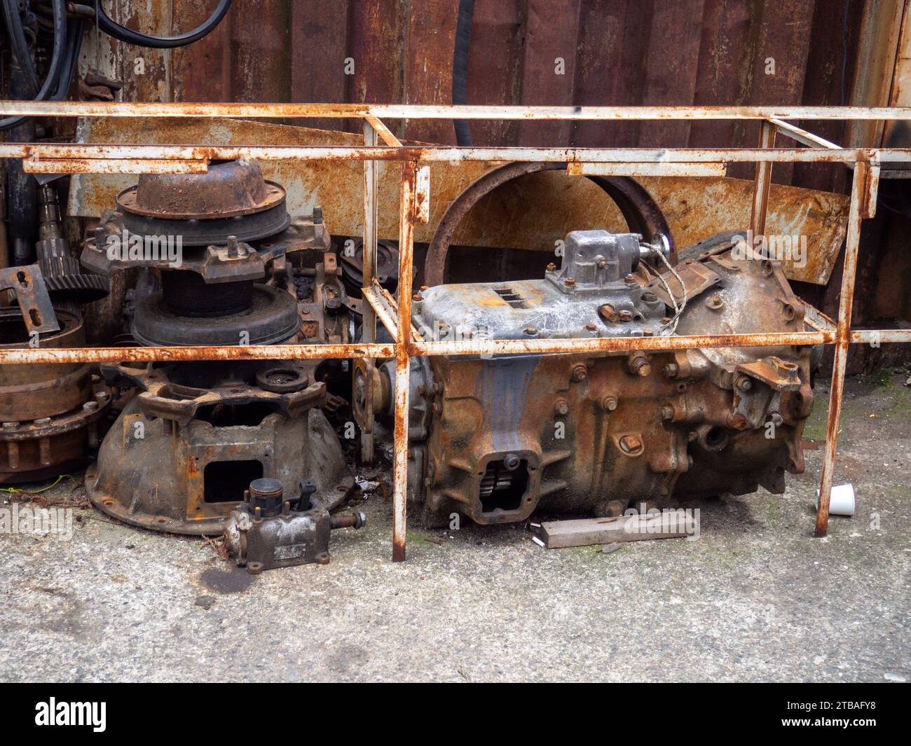 In an old auto repair shop. Rusty spare parts and machine elements ...