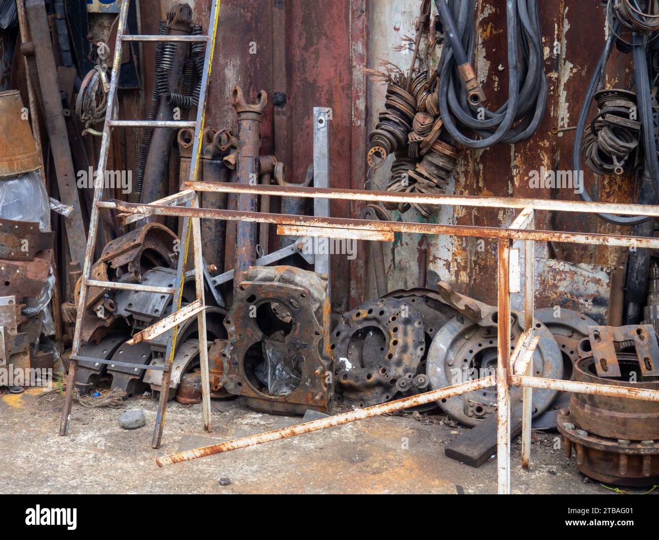 In an old auto repair shop. Rusty spare parts and machine elements ...