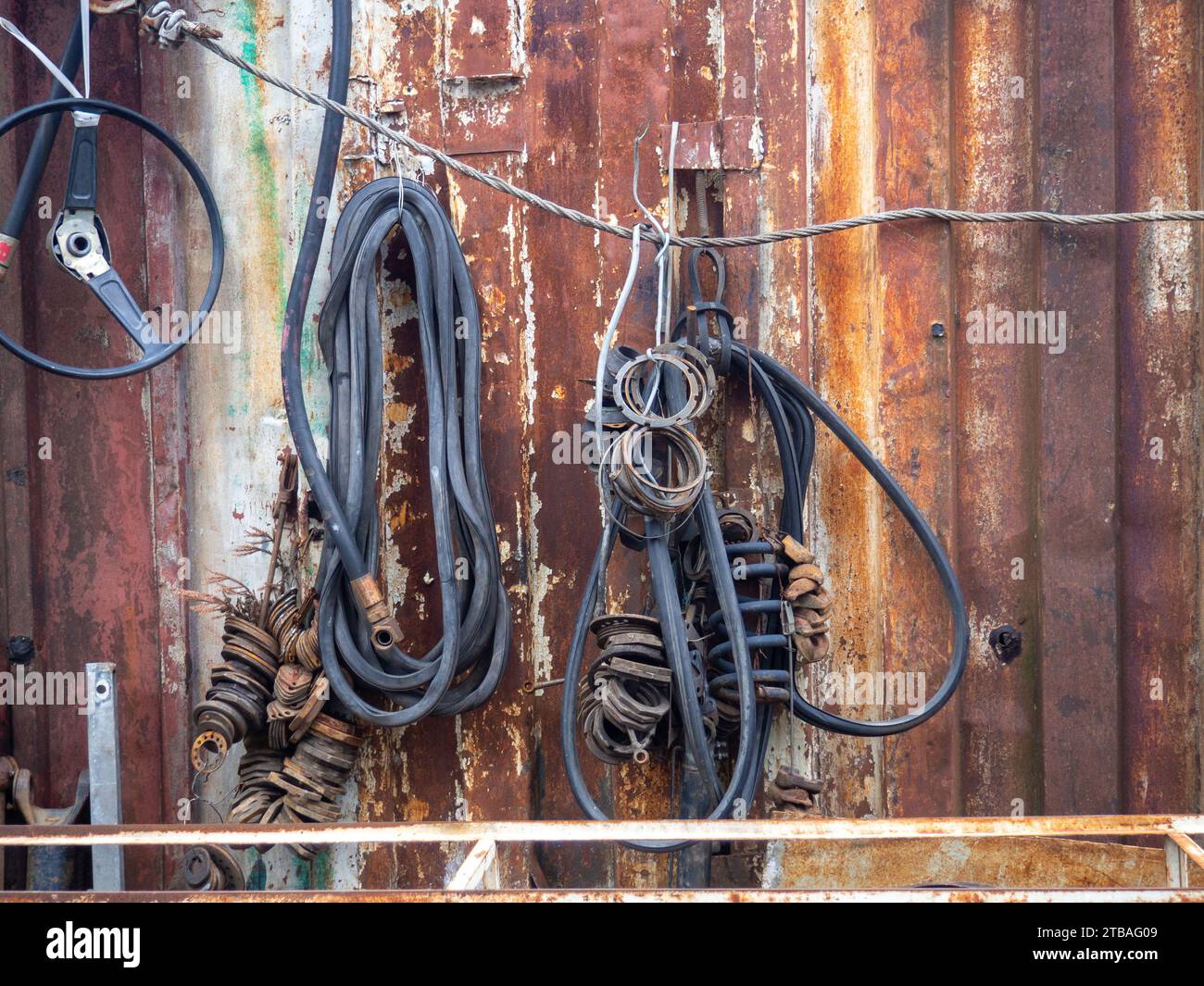 In an old auto repair shop. Rusty spare parts and machine elements ...