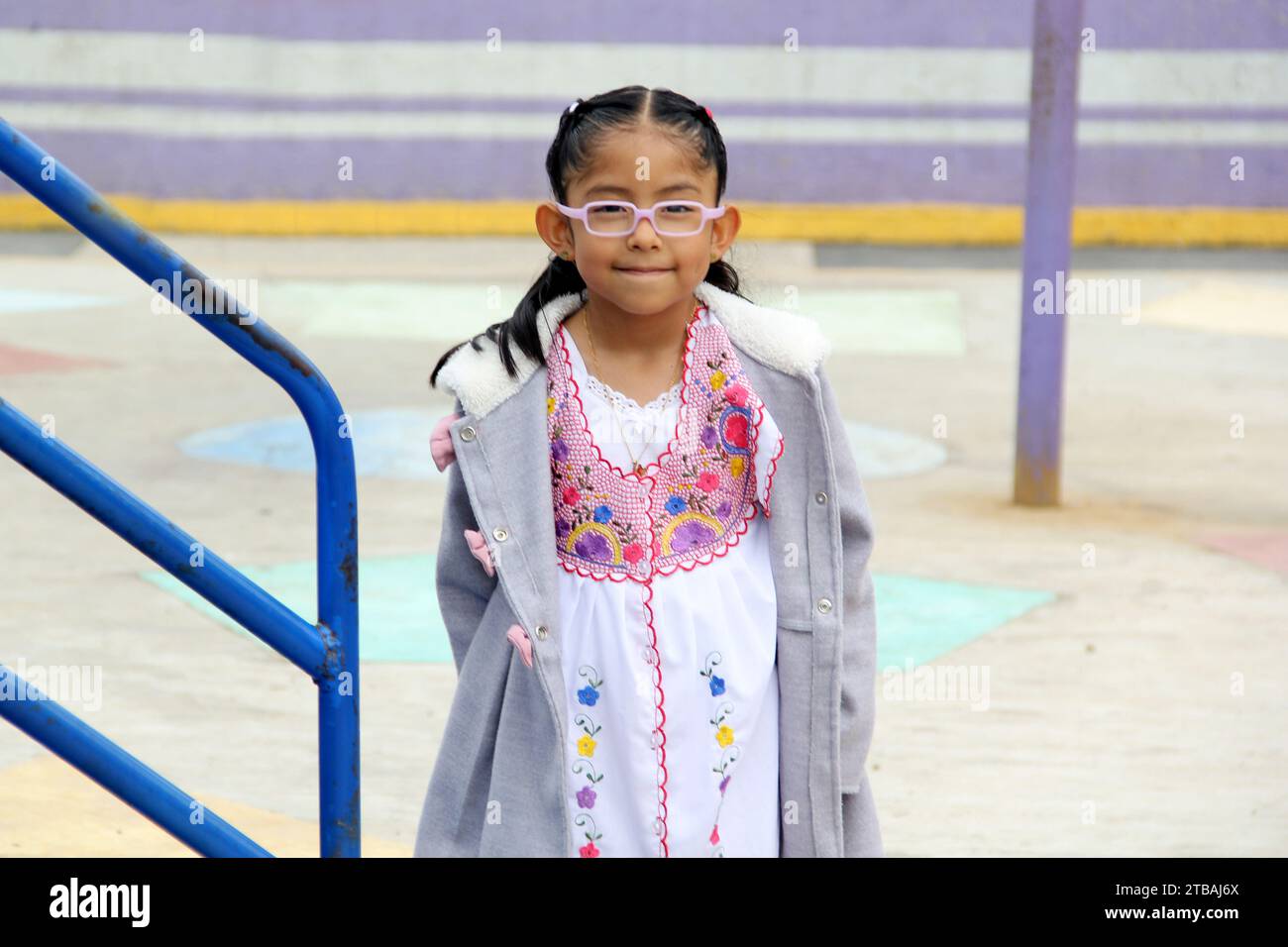 Indigenous 4 year old girl with traditional dress and huaraches plays ...