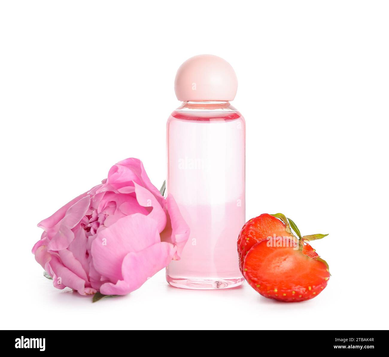 Bottle of cosmetic product, strawberry and peony flower on white ...