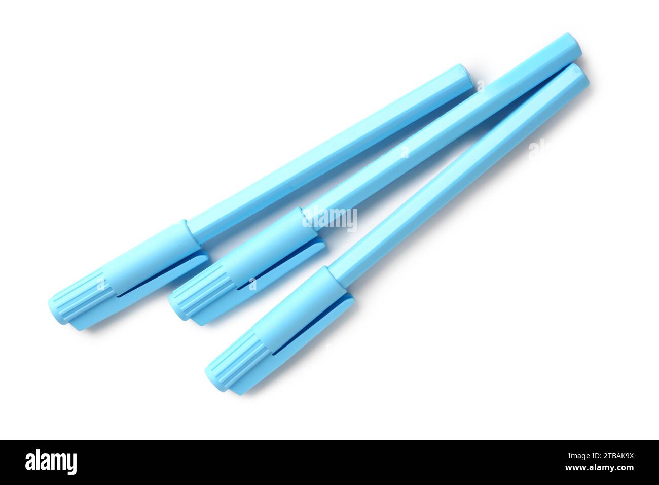 Blue pens on white background Stock Photo - Alamy