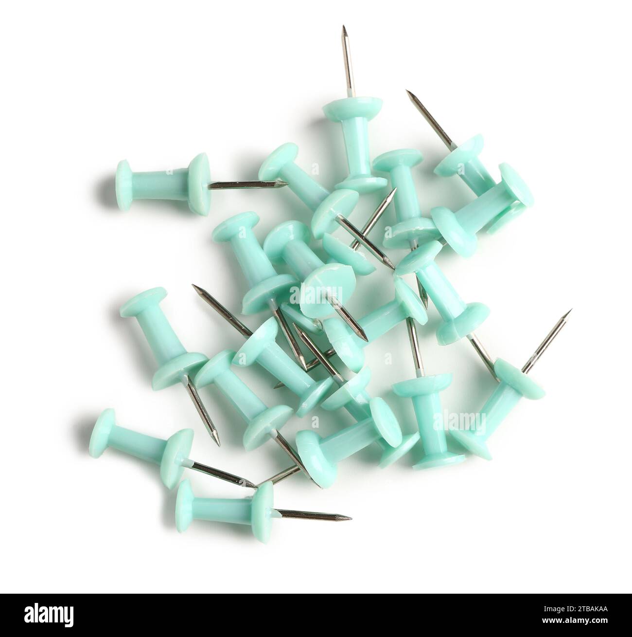 Turquoise paper pins on white background Stock Photo - Alamy