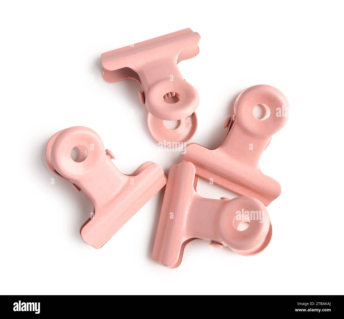 Pink binder clips on white background Stock Photo - Alamy
