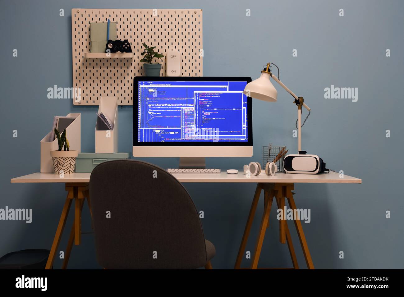 Interior of office with programmer's workplace and pegboard Stock Photo ...