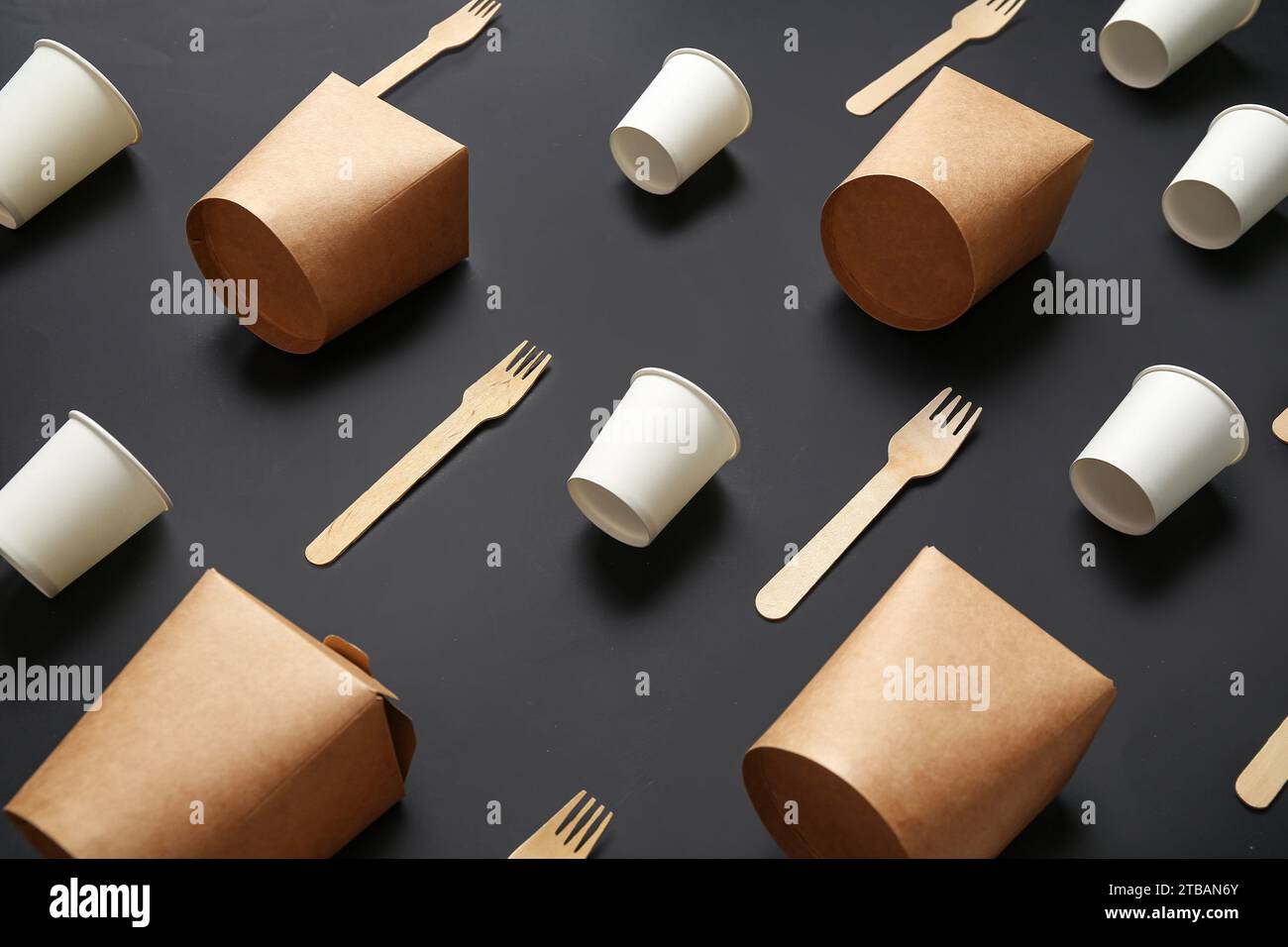 Takeaway paper cups, boxes and forks on black background Stock Photo ...