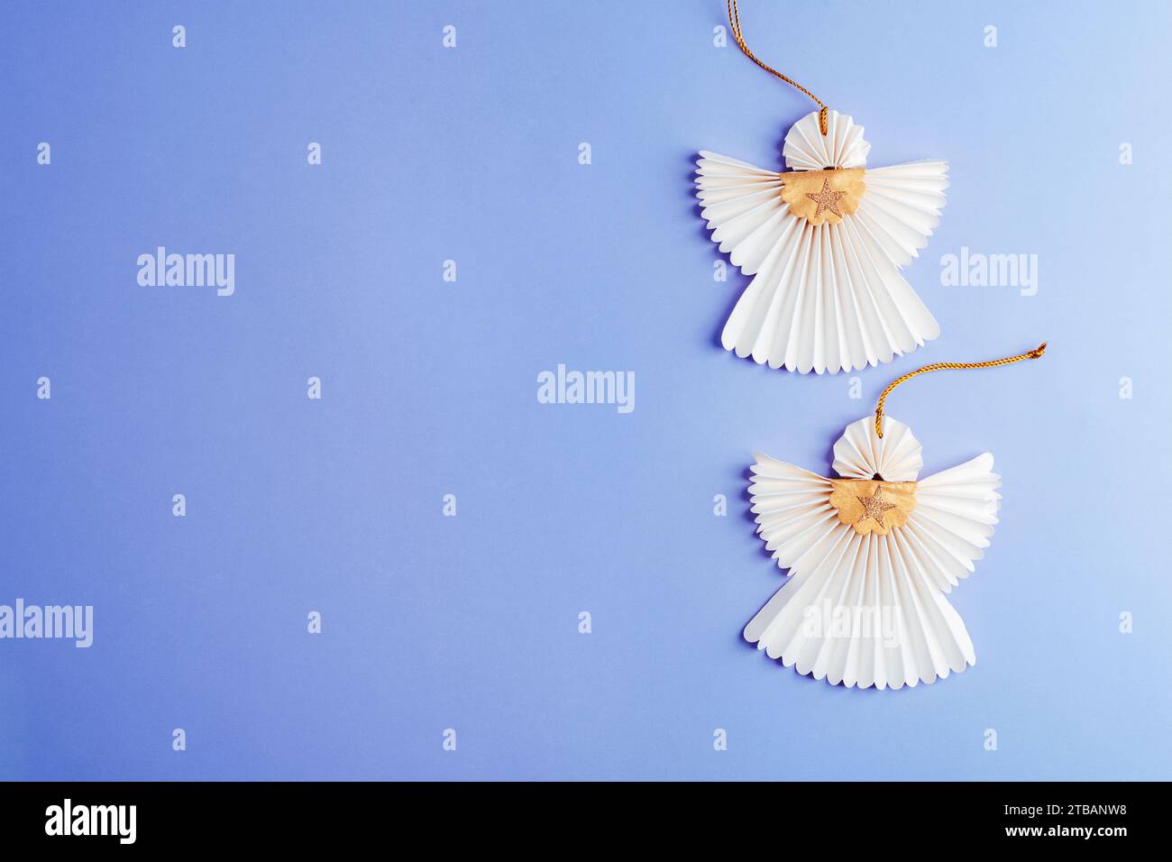 Paper angels on purple background. Christmas concept. Top view, flat ...