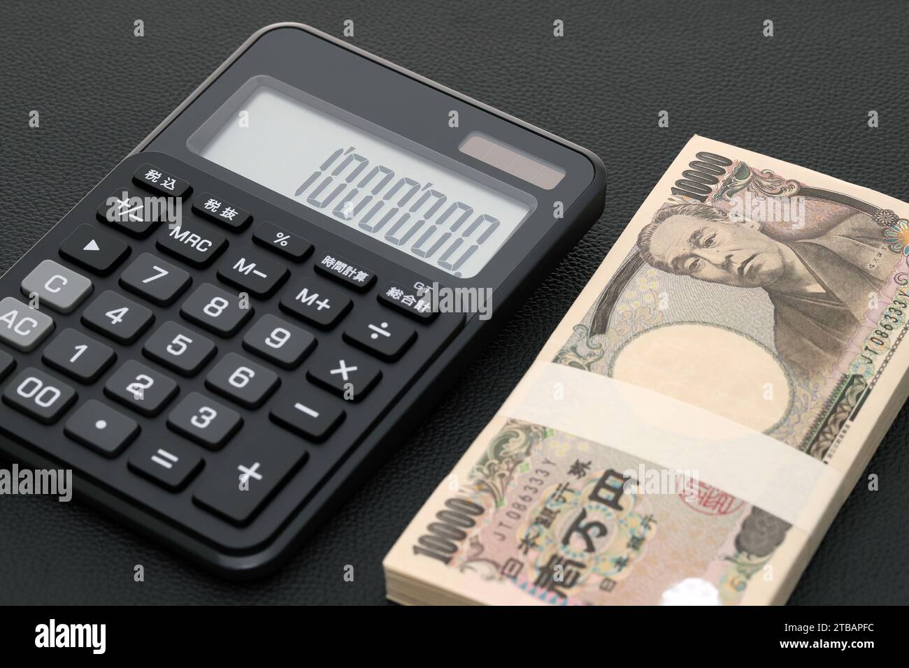 Japanese salary envelope and calculator, The banknotes are written as ...