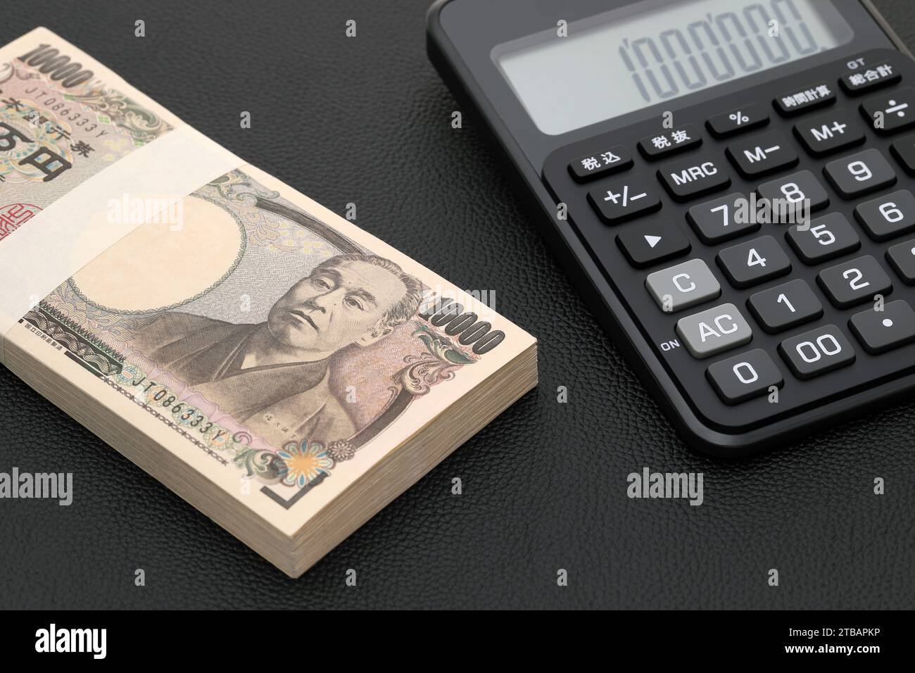 Japanese salary envelope and calculator, The banknotes are written as ...