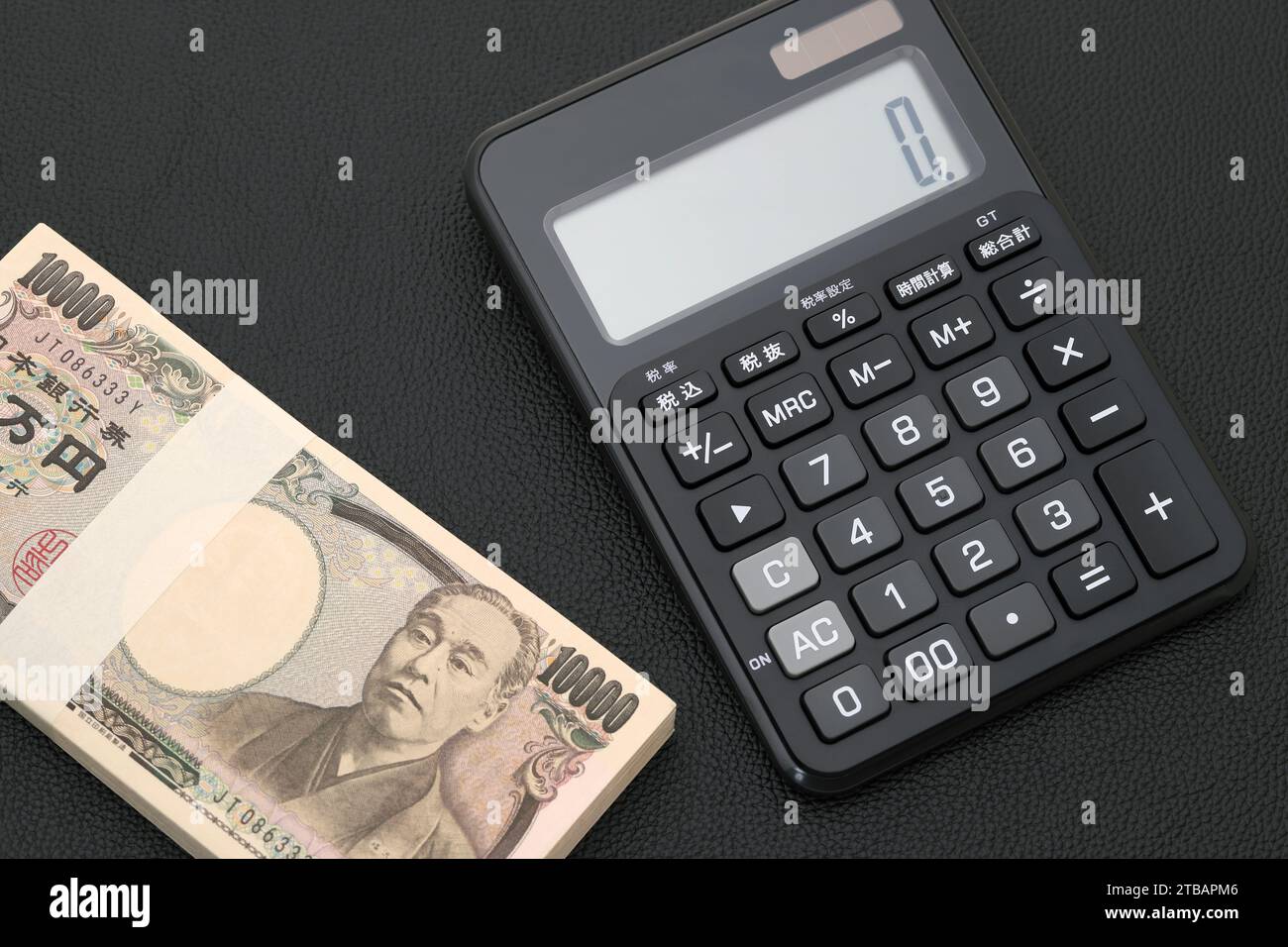 Japanese salary envelope and calculator, The banknotes are written as ...