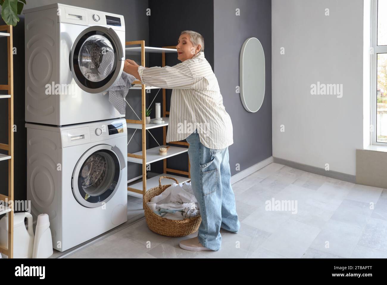 Mature woman washing machine hi-res stock photography and images - Alamy